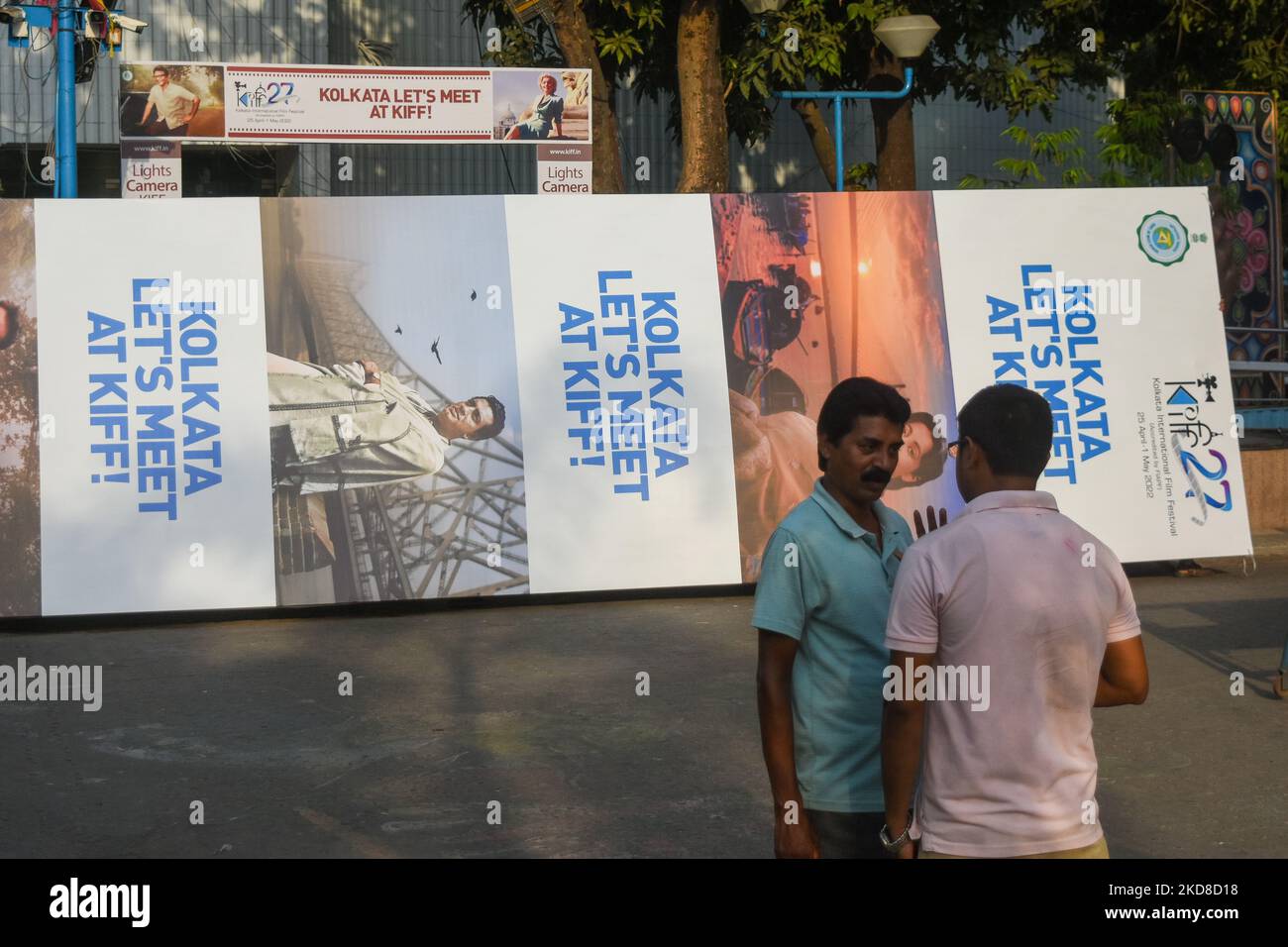 Workers are seen carrying a banner of KIFF at Nandan fil center in ...