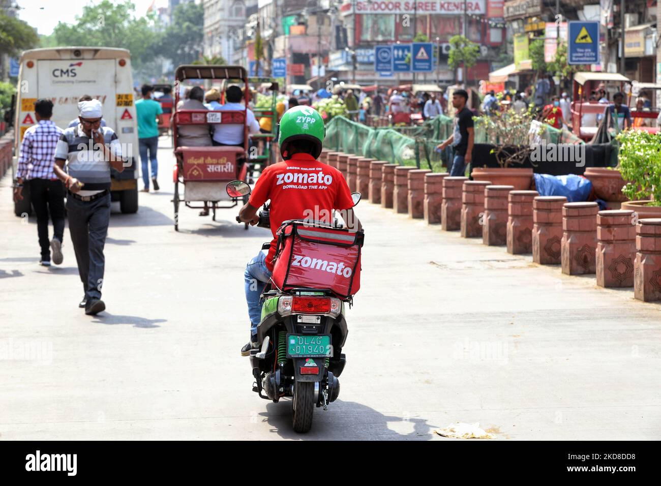 A Zomato delivery boy rides through Old Delhi India on 25 April 2022 ...