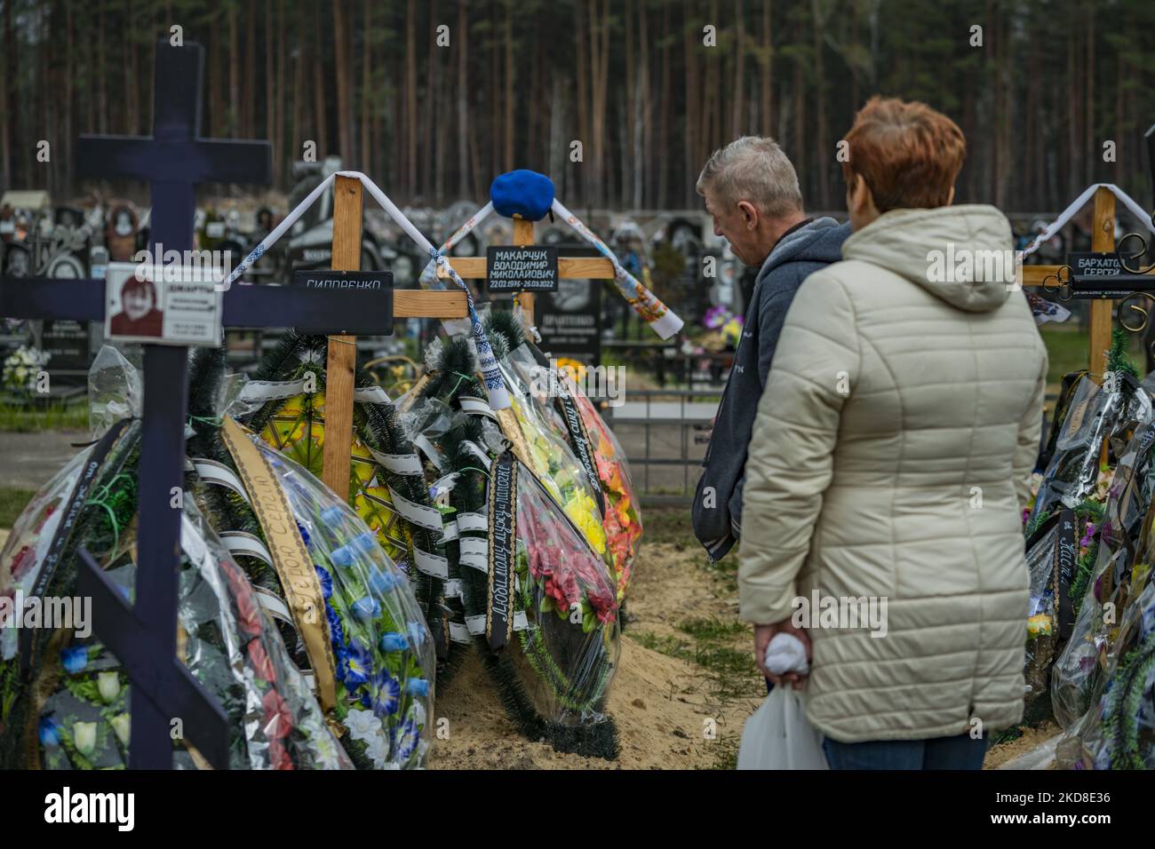 A couple visit the grave of a relative soldier killed during the ...