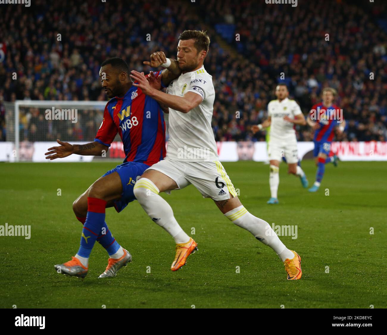 : L-R Crystal Palace's Jordan Ayew and Liam Cooper of Leeds ...