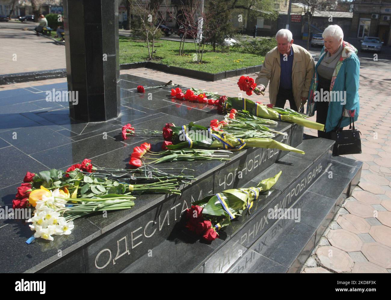 Ukrainians lay flowers to a memorial of victims of the Chernobyl ...