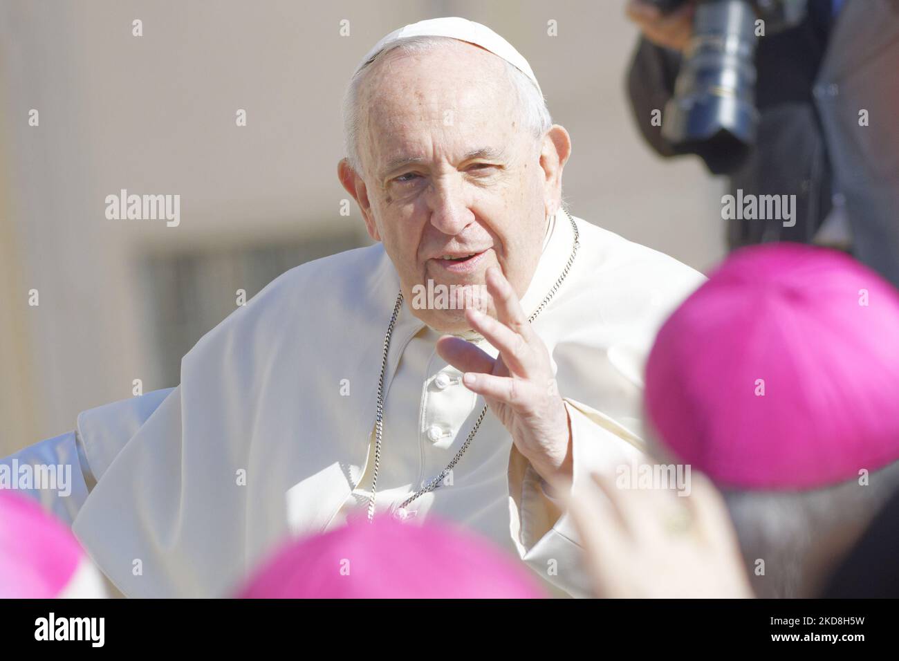 Pope Francis salutes bishops at the end of his weekly general audience ...