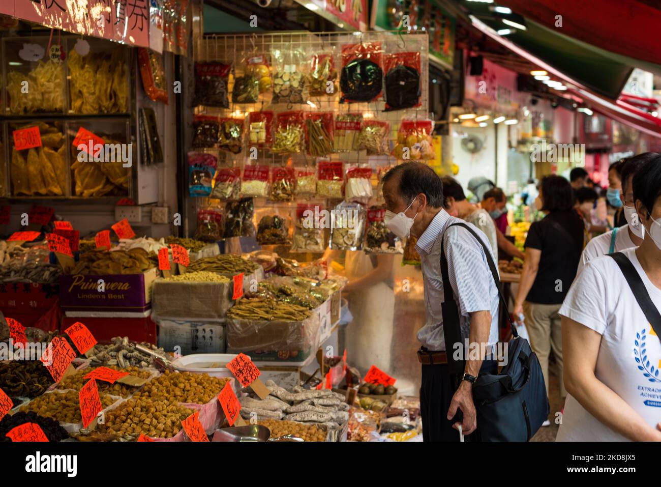 Hong Kong, China, 28 Apr 2022, A man looks at products on offer at a ...