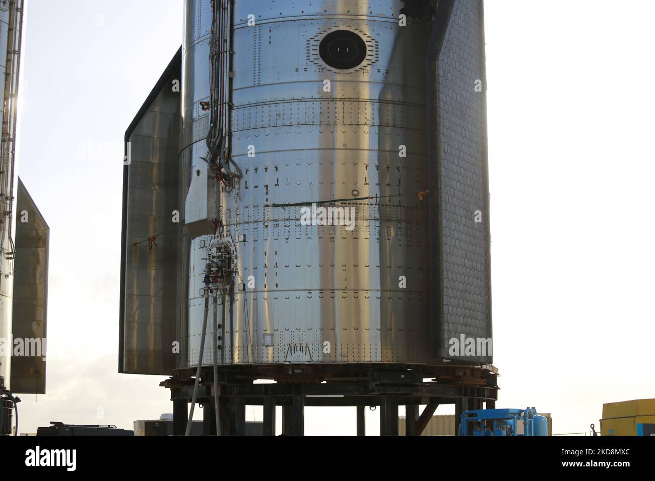 Starship 22 stands behind the build site at SpaceX's South Texas campus ...