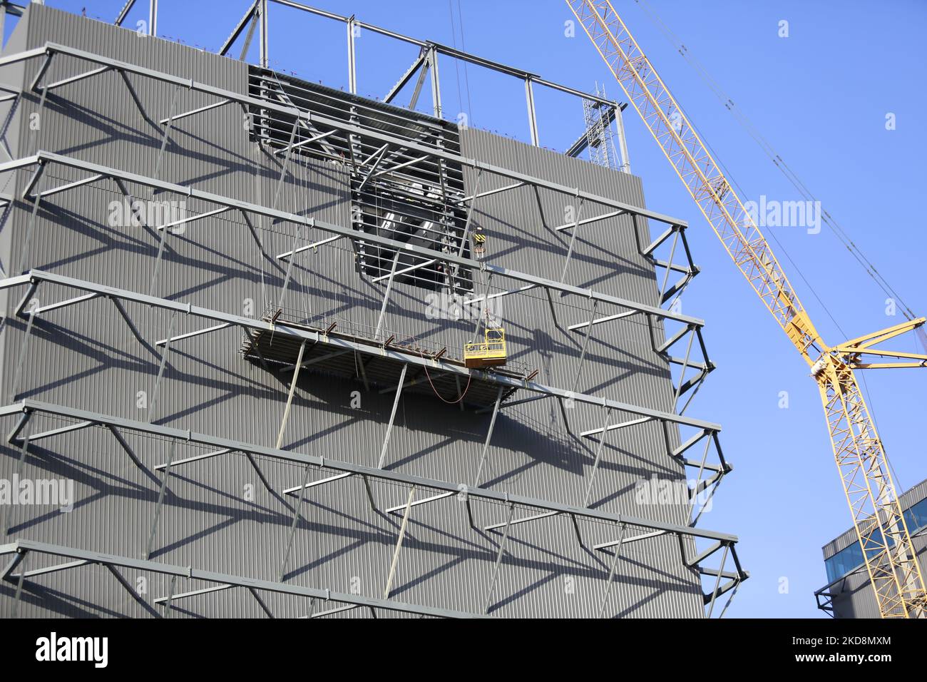 Workers put finishing touches on the enormous new wide bay at the build site. (Photo by Reginald ...