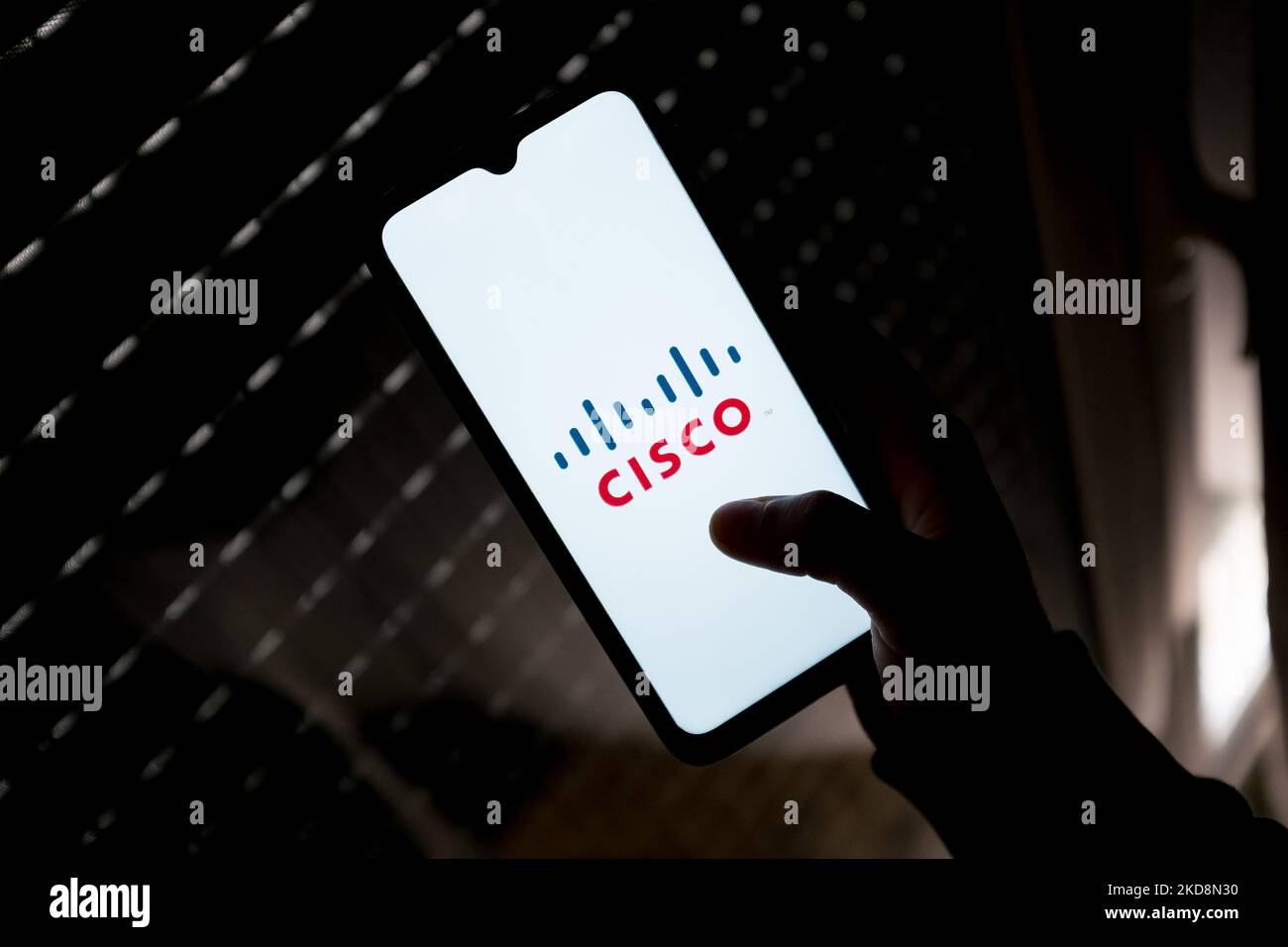 In this photo illustration a Cisco Systems logo seen displayed on a ...
