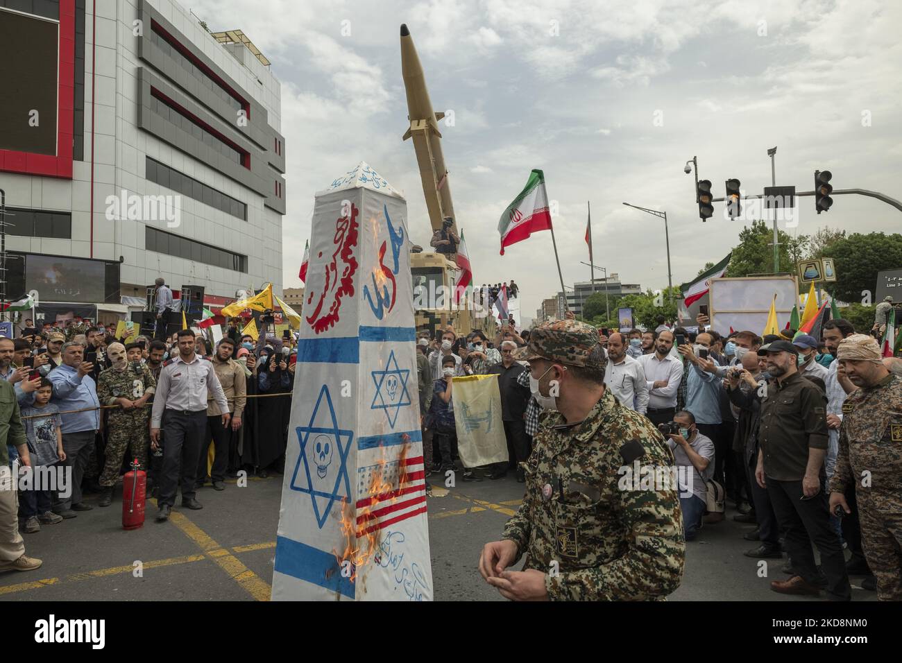 An Islamic Revolutionary Gurd Corps (IRGC) military personnel looks at ...