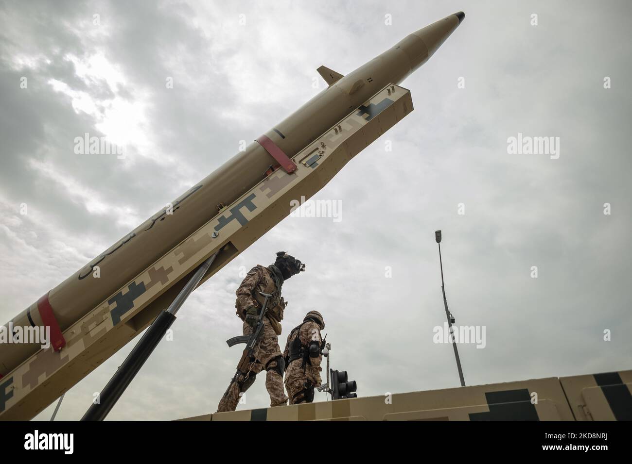 Two Islamic Revolutionary Guard Corps (IRGC) military personnel stand ...