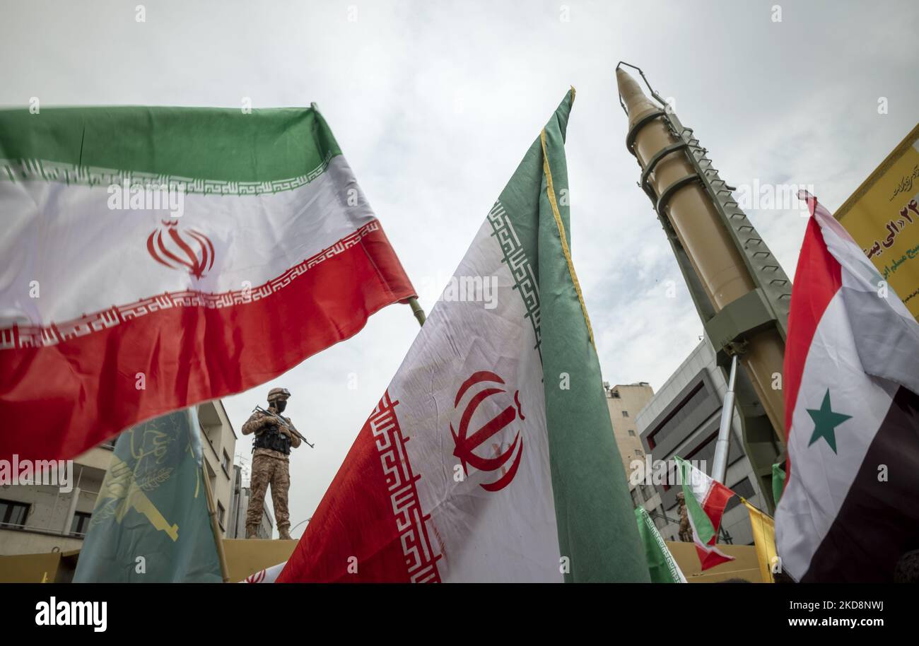 An Islamic Revolutionary Guard Corps (IRGC) military personnel stands ...