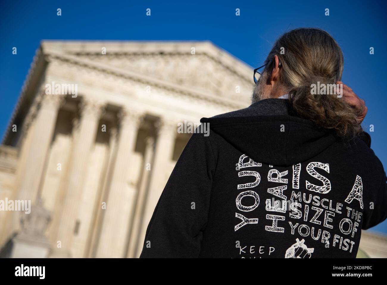 People attend a vigil at the Supreme Court building in Washington, D.C ...