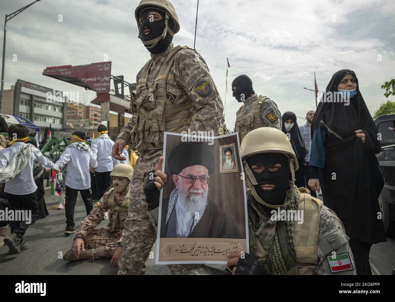 An Islamic Revolutionary Guard Corps (IRGC) military personnel holds a ...