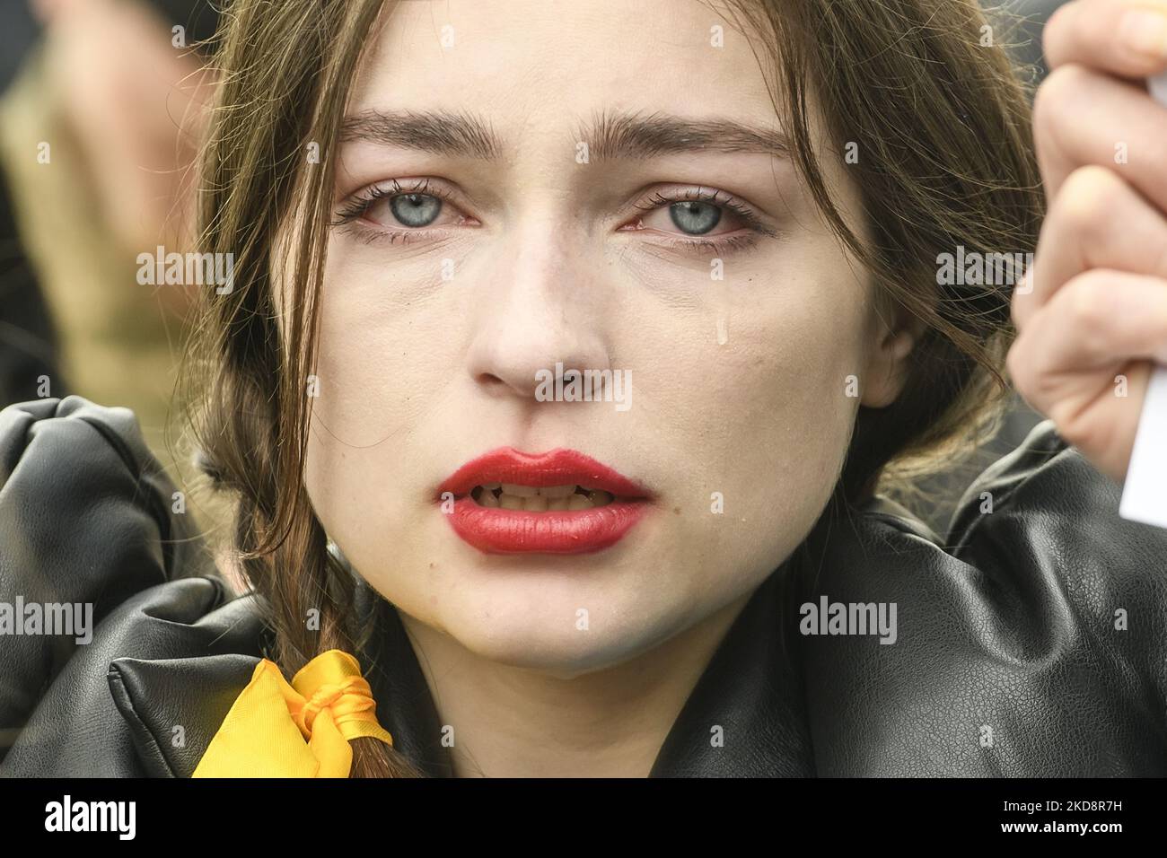 A young woman cries during a rally demanding ukrainian and ...