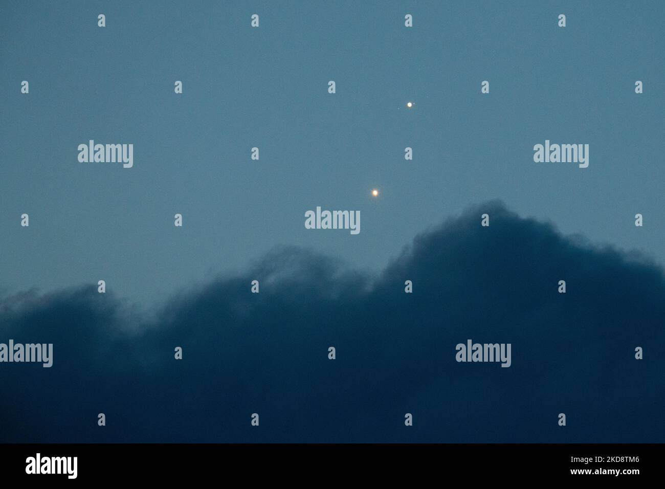 Planets Jupiter and Venus in conjunction rise before sunrise behind Rocca Calascio castle, Italy ...
