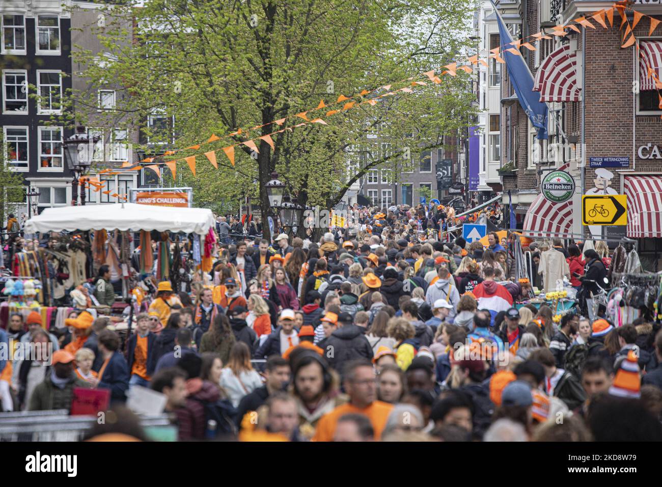 Crowds of people wearing mainly orange clothes and having the Dutch ...