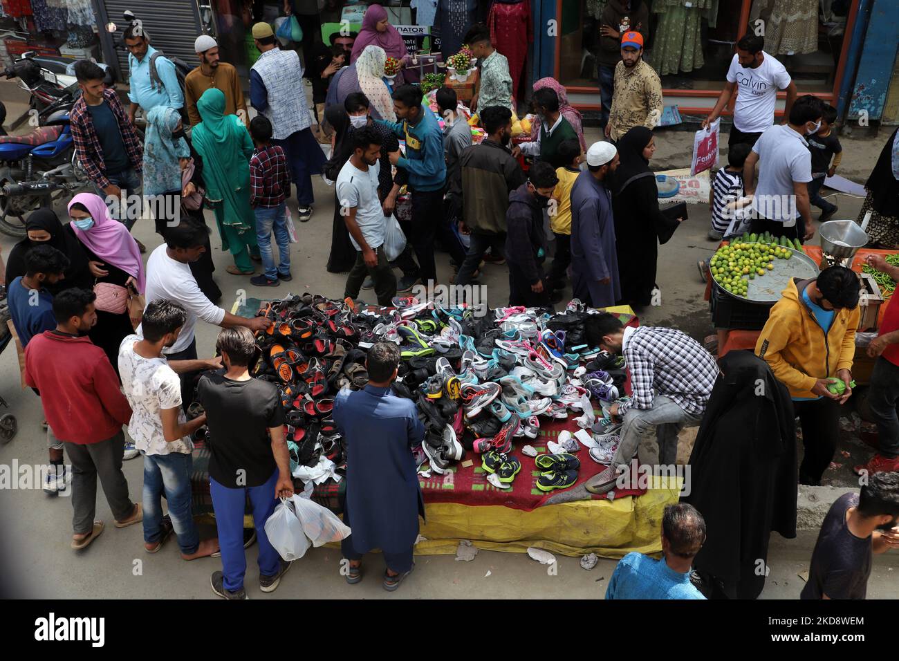 People purchase goods ahead of Eid-Ul-Fitr in Sopore, District ...
