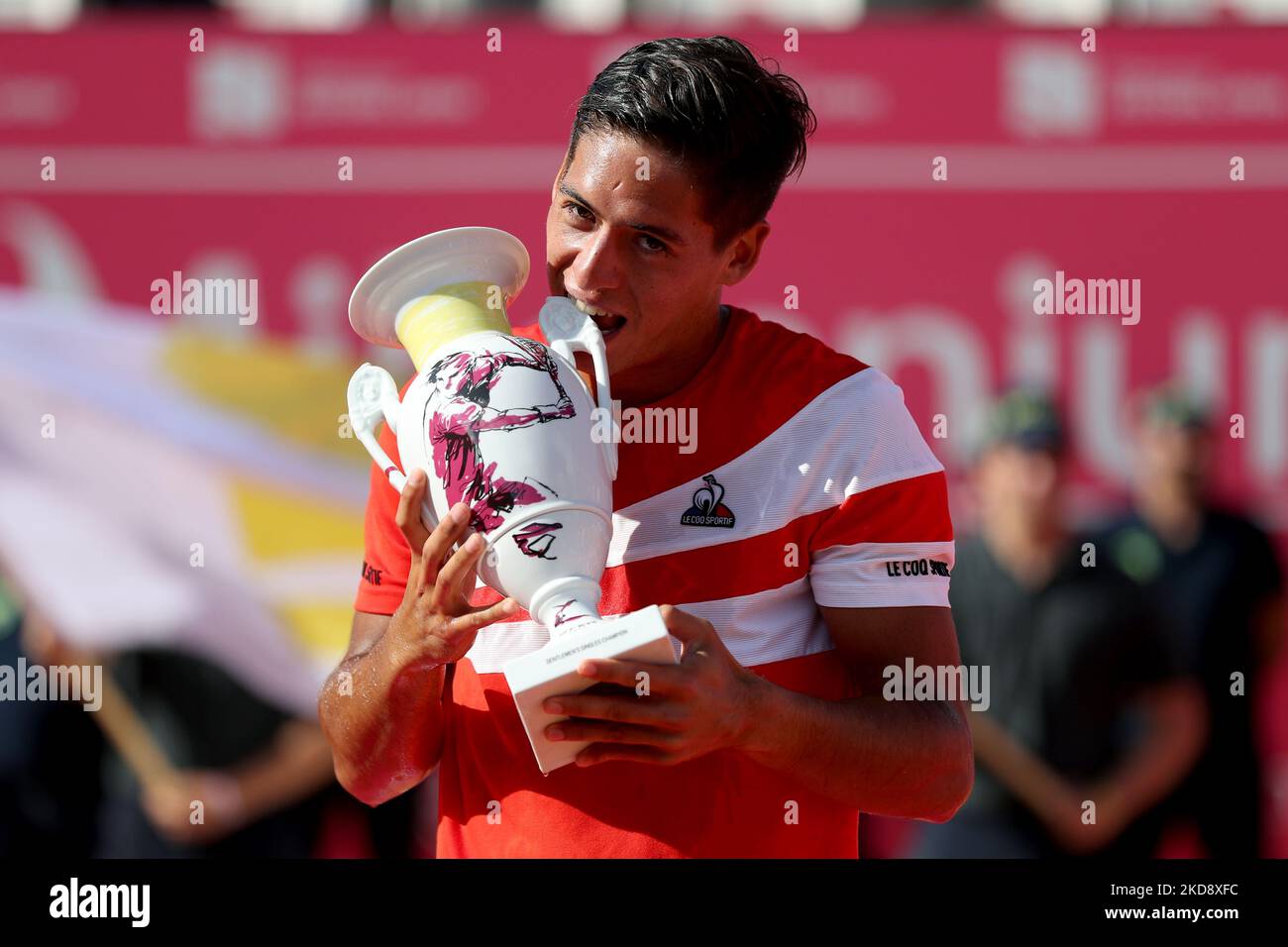 Sebastian Baez of Argentine celebrates with the trophy after winning ...
