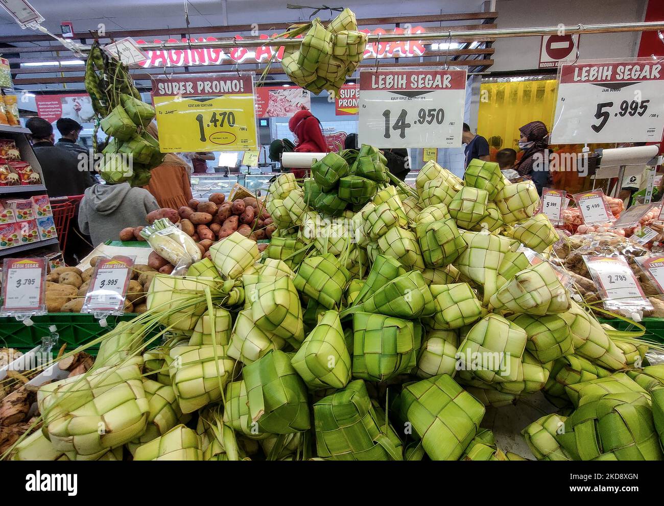 Coconut leaves used to make traditional rice cakes called 'Ketupat' in ...