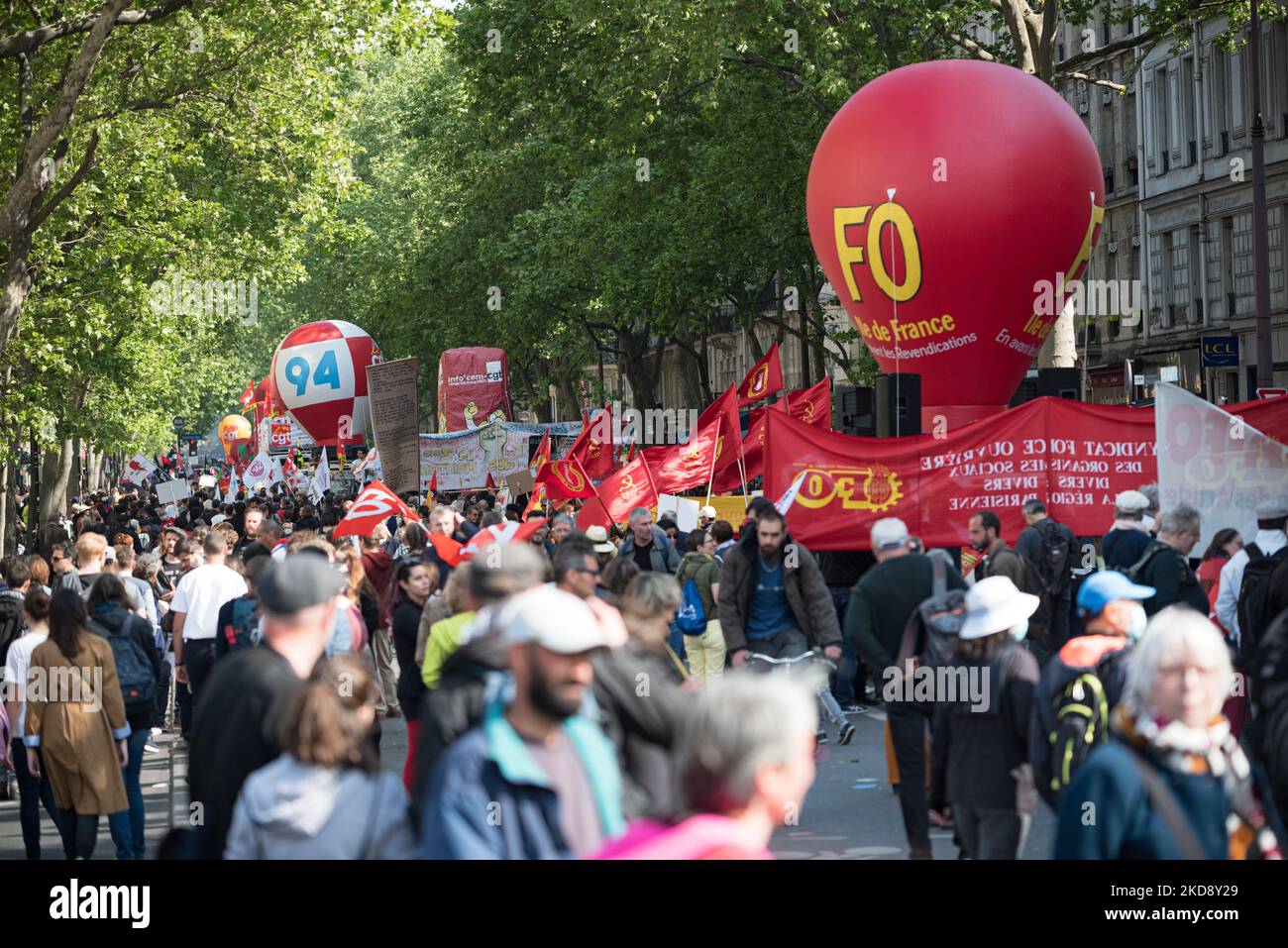 Several thousand demonstrators waving union and political party flags ...