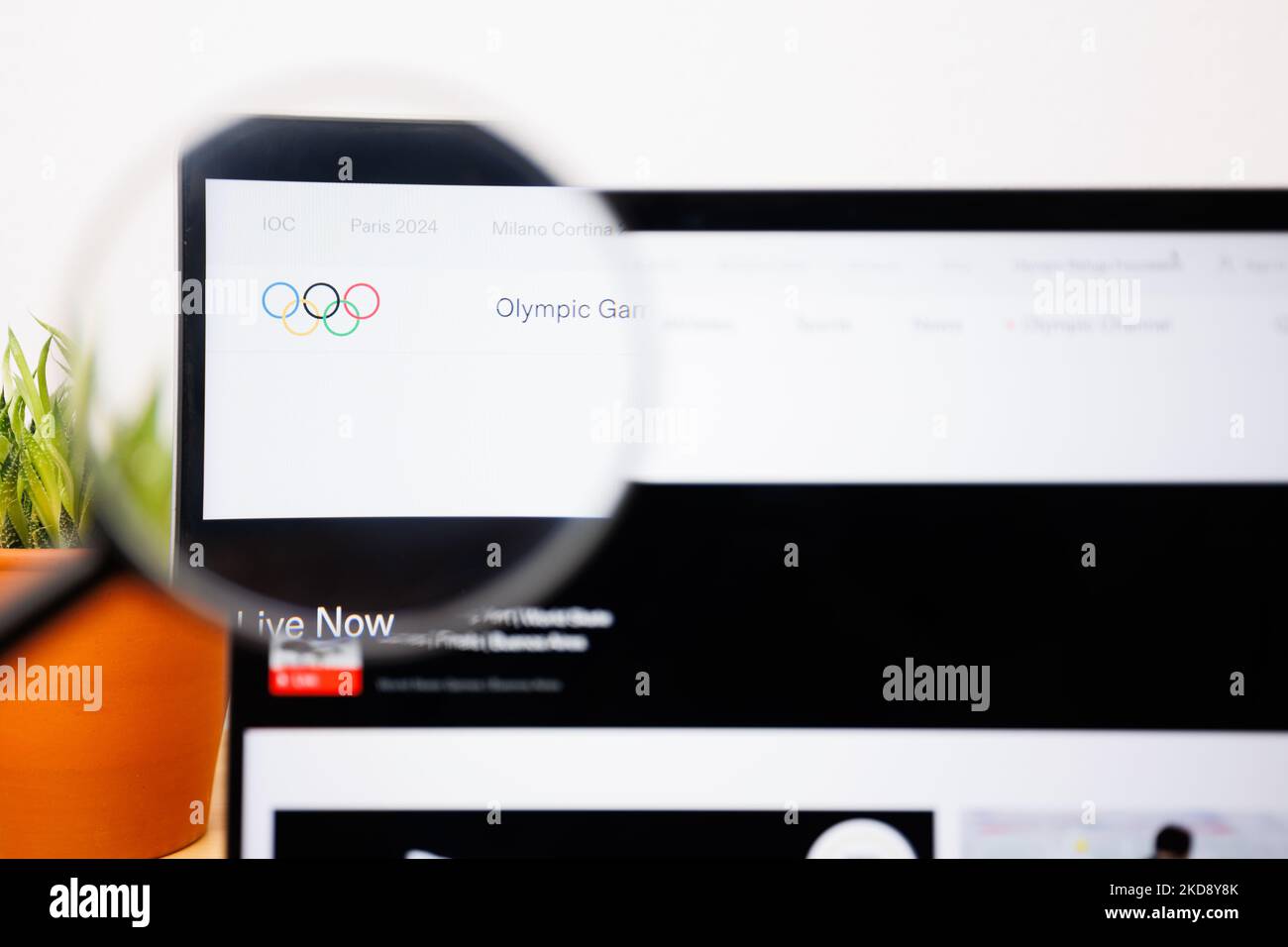 An Olympic Games Logo under a magnifying glass. Olympic Games Website ...