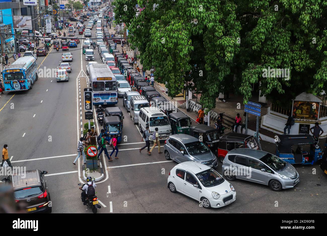 Vehicles queue up to use the fuel pumps at a fuel station in Colombo on ...