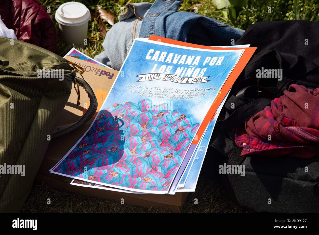 Posters are seen at a Caravan for The Children rally at Lafayette Park ...