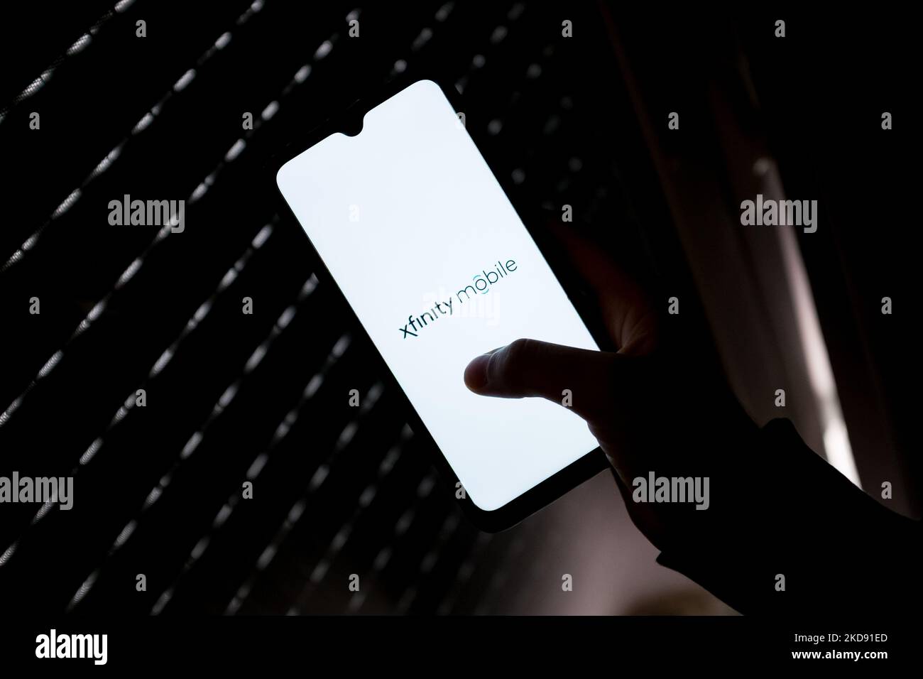 In this photo illustration a Xfinity Mobile logo seen displayed on a ...