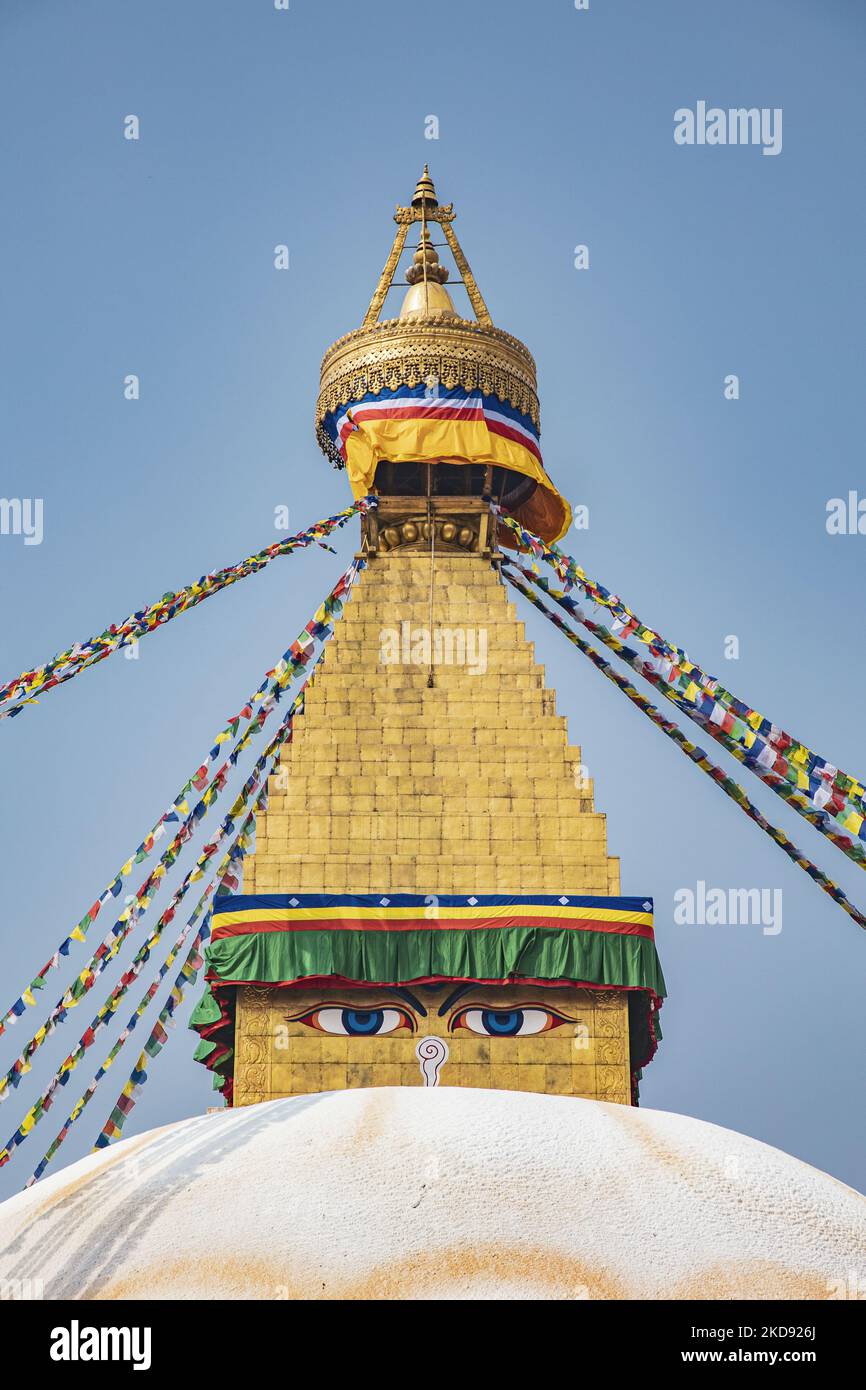 Closeup at the golden top with the Eyes of the stupa, where the praying ...