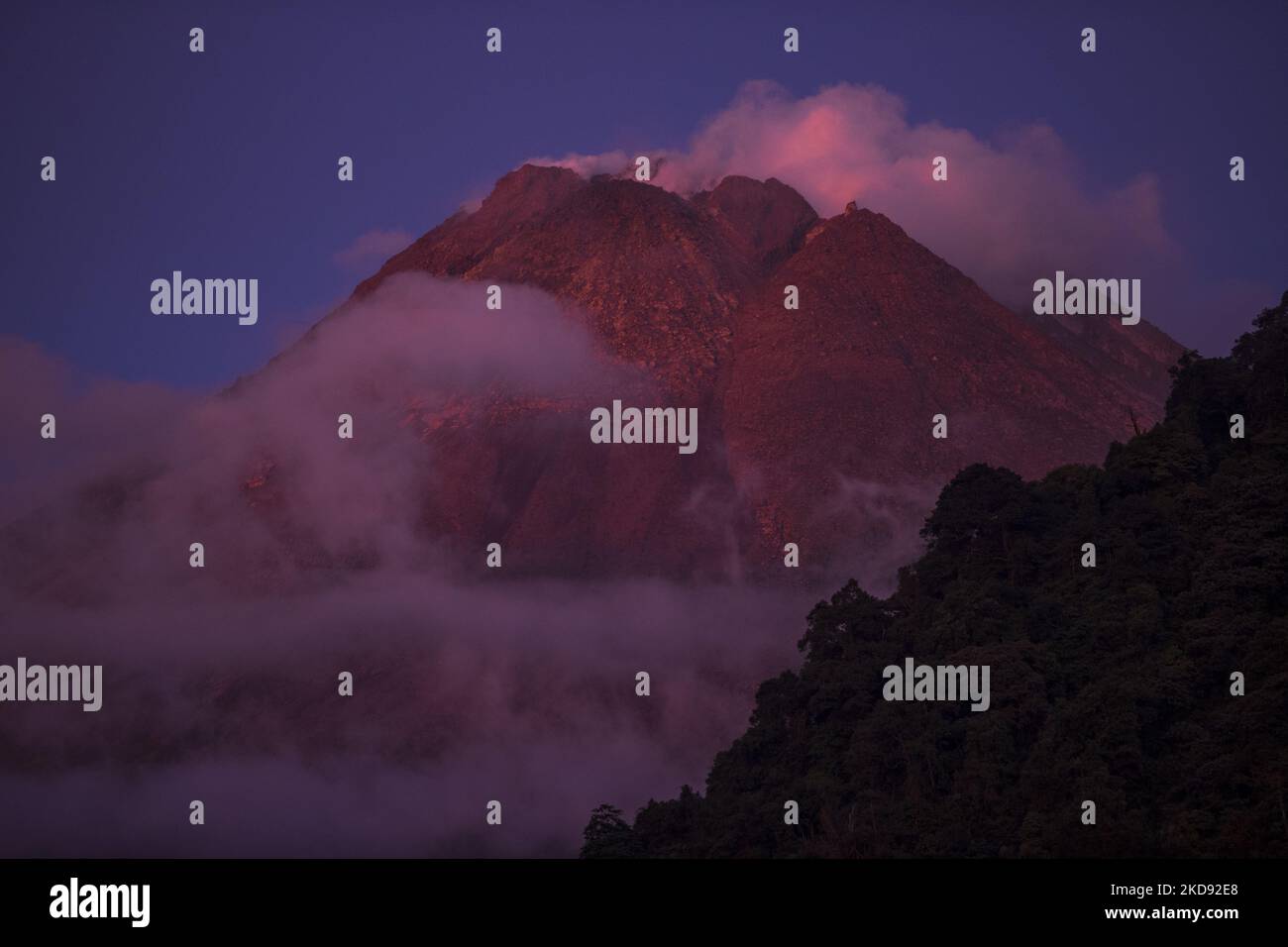 Mount Merapi, a volcanic mountain spews lava as it erupts several times ...