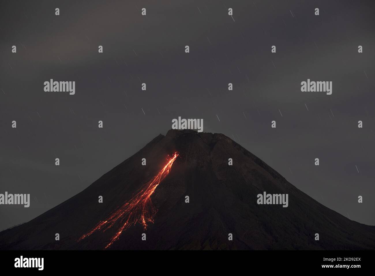 Mount Merapi, a volcanic mountain spews lava as it erupts several times ...