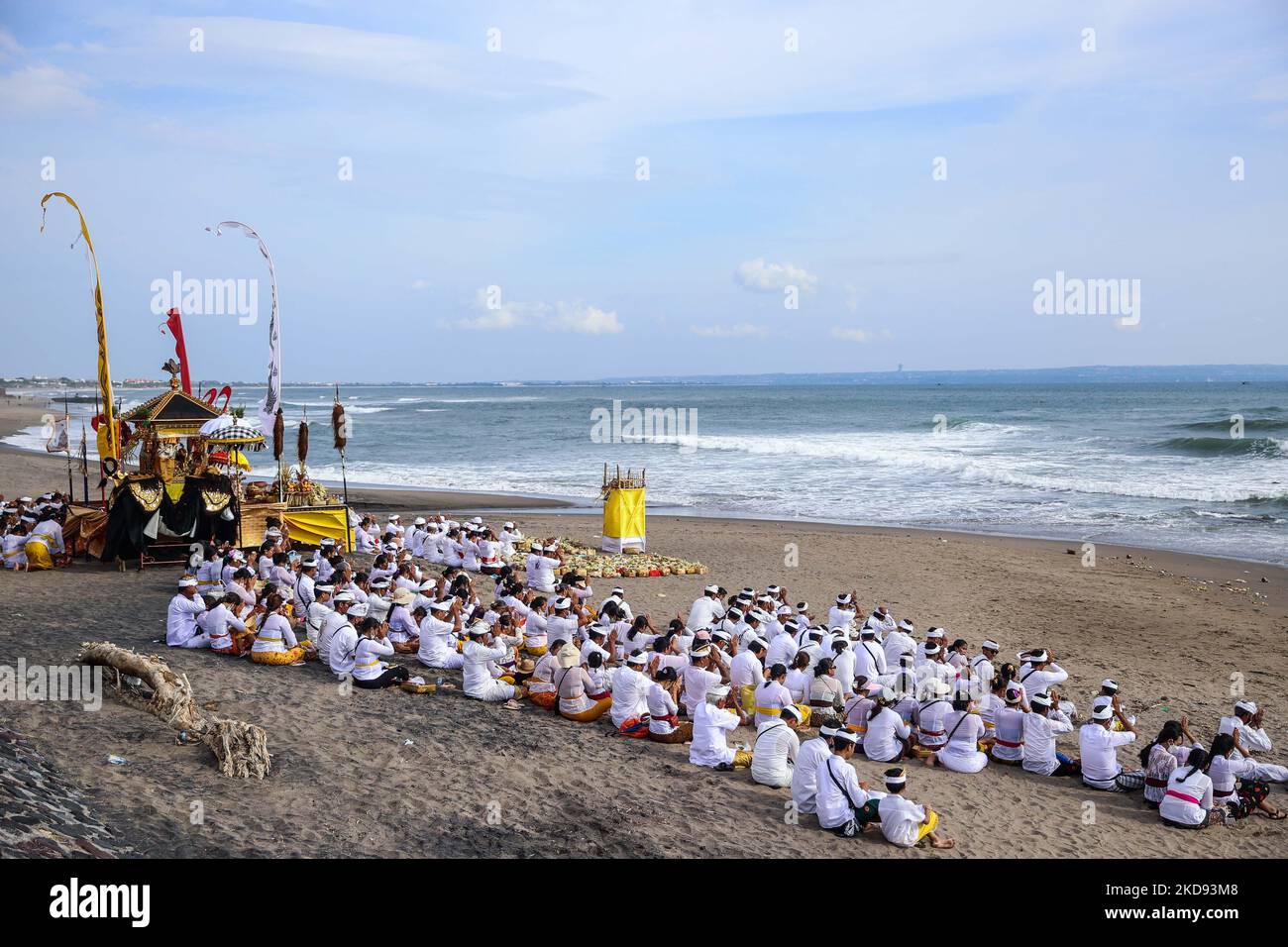 Balinese Hindu devotees gather as they perform prayers during the ...