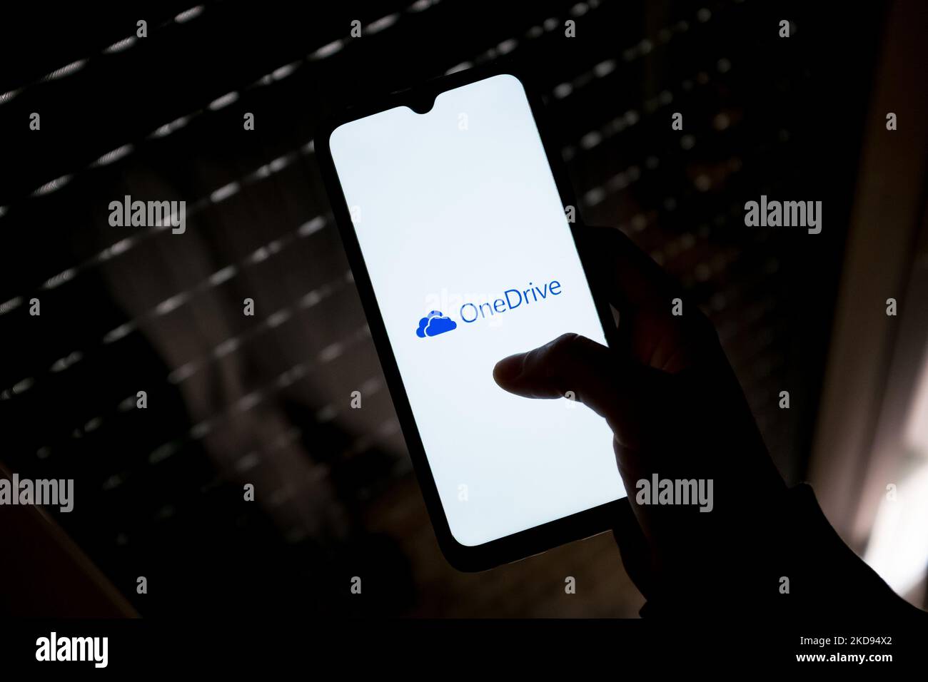 In this photo illustration an OneDrive logo seen displayed on a ...