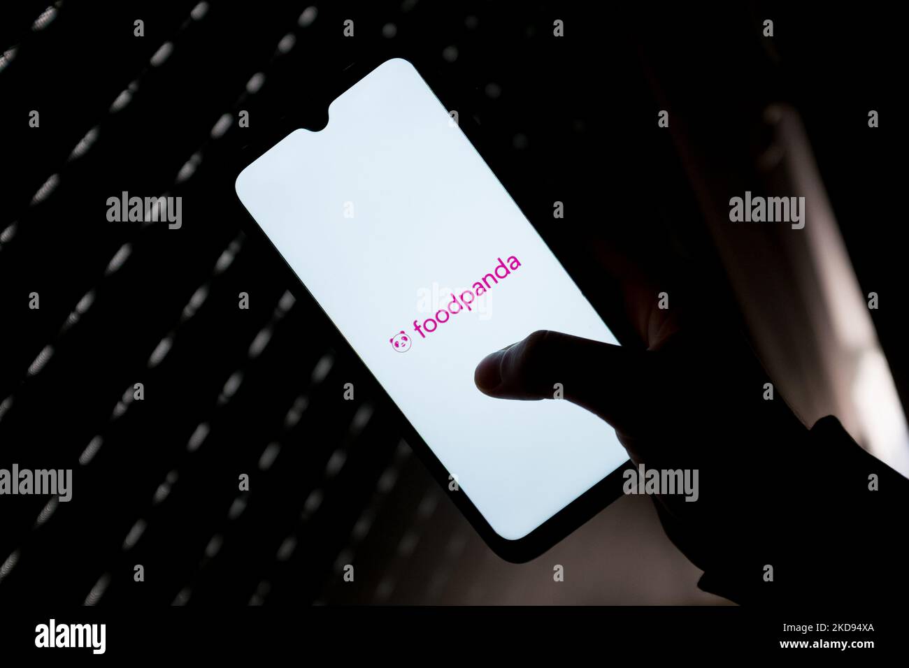 In this photo illustration a Foodpanda logo seen displayed on a ...