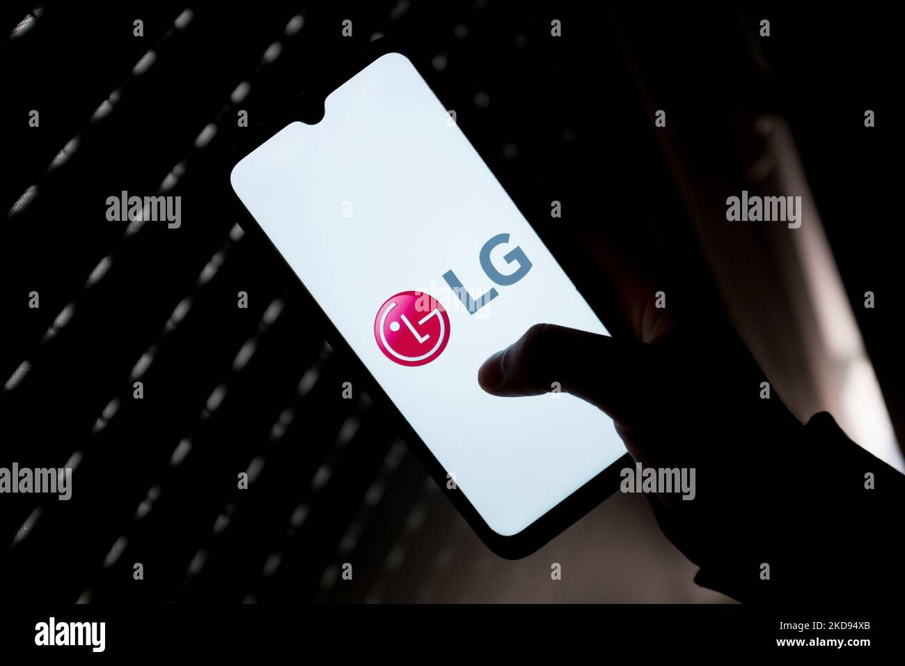 In this photo illustration a LG Corp. logo seen displayed on a ...