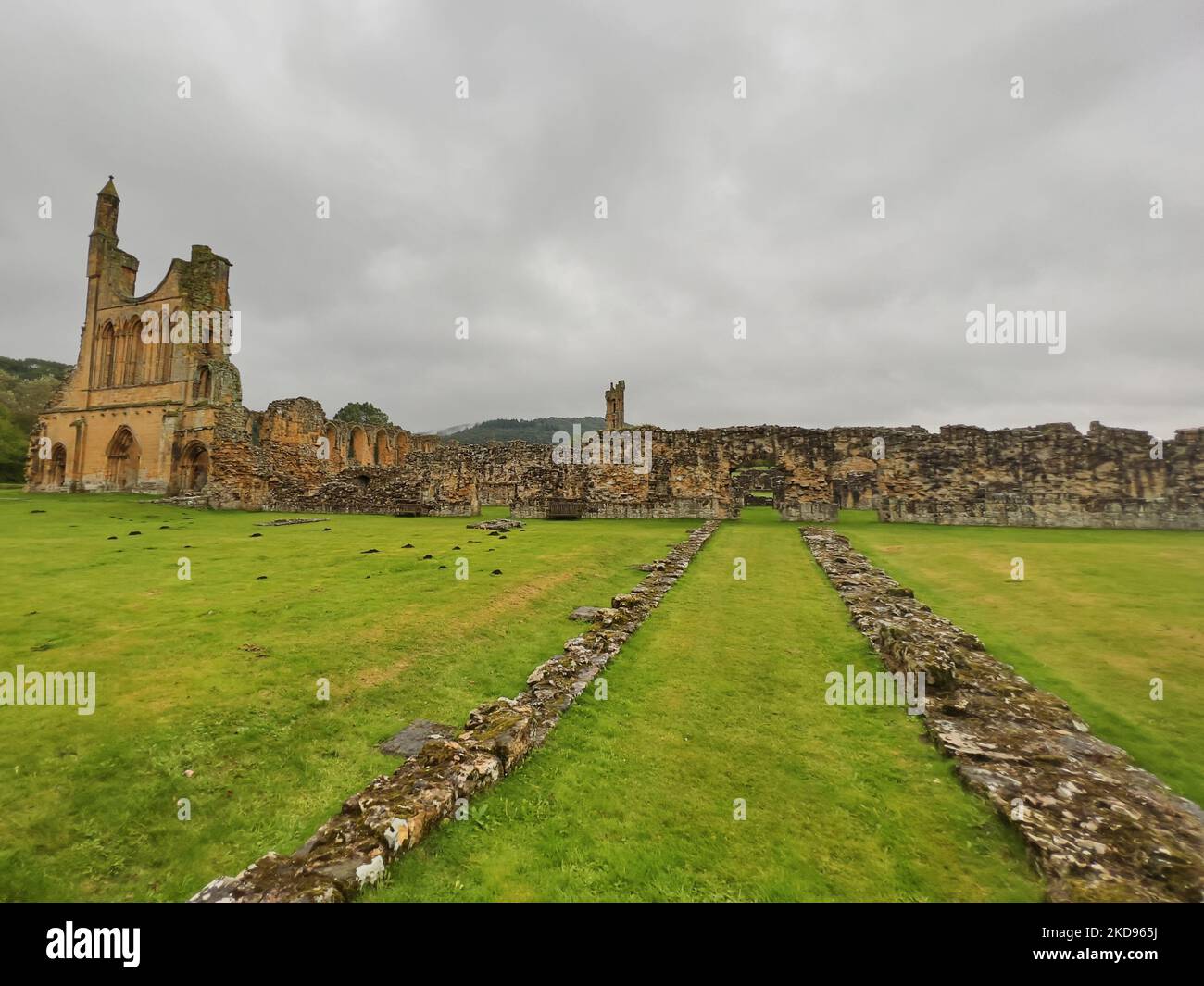 The Byland abbey ruins with grass landscape and cloudy gray sky Stock ...