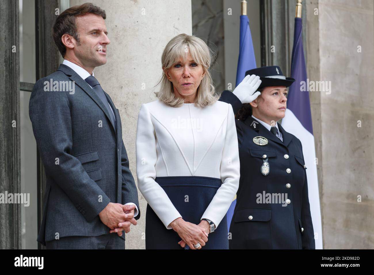 French President Emmanuel Macron (L) and his wife Brigitte Macron (R ...