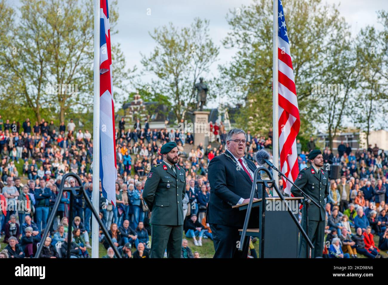 Hubert Bruls is giving a speech at the "Keizer Traianusplein", where ...