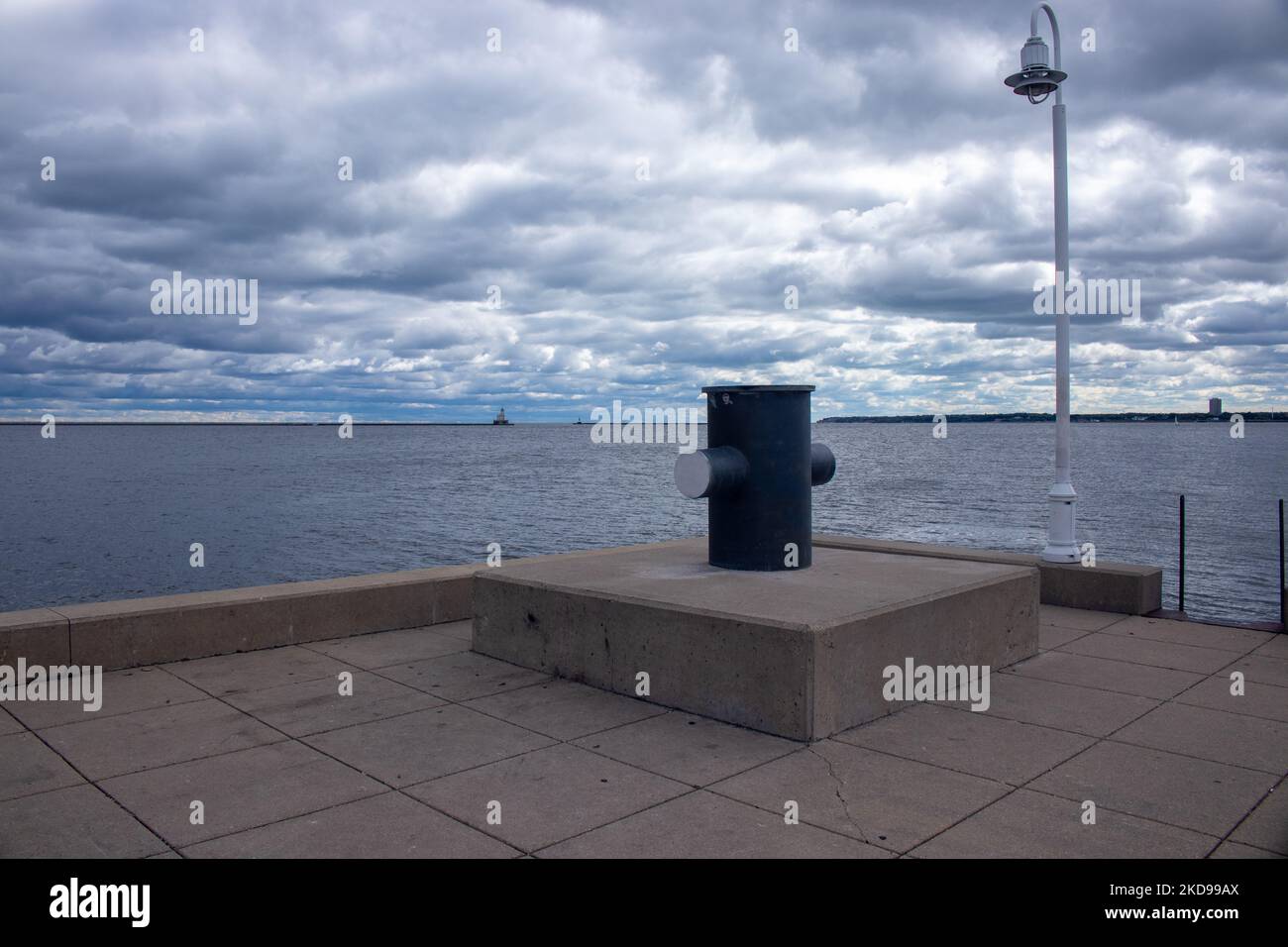 Tie down for a large ship on a boat dock located on Lake Michigan Stock ...