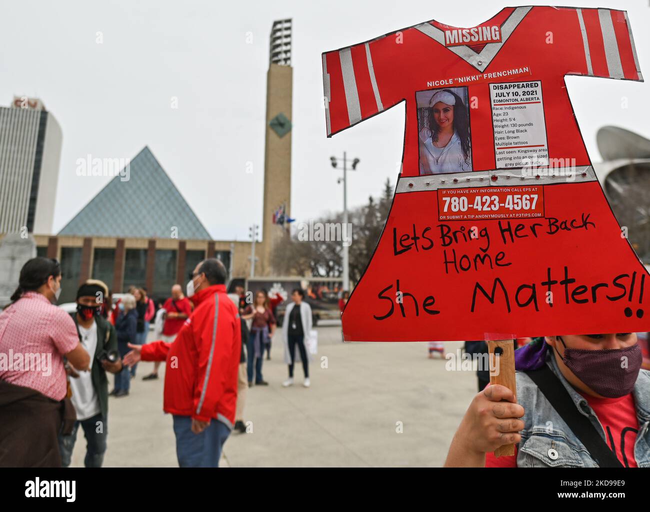 People arrive at Churchill Square ahead of the annual Red Dress Day march in downtown Edmonton ...