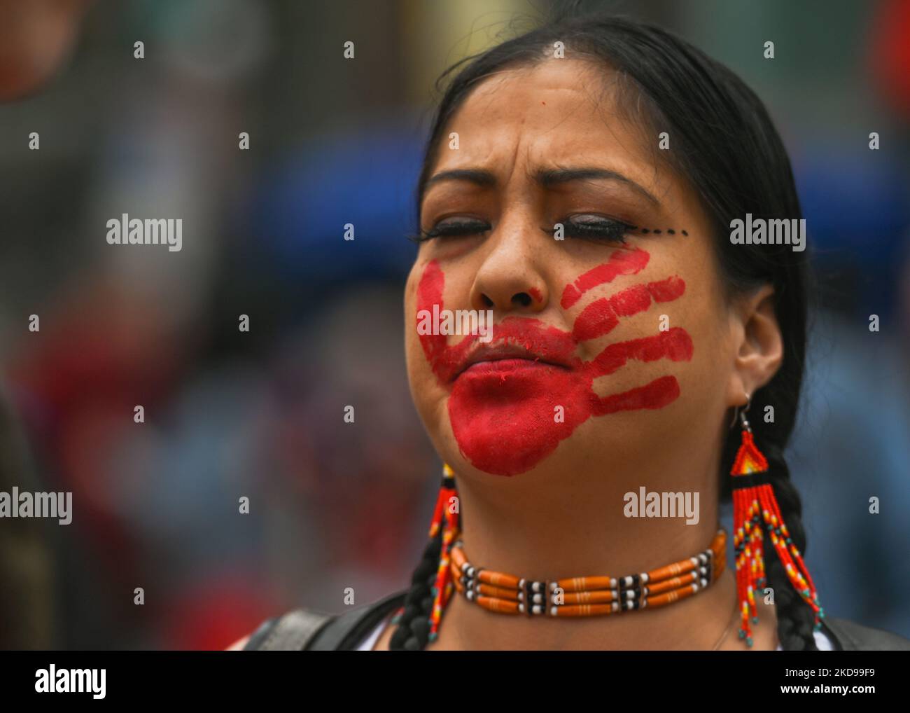 A participant during the annual Red Dress Day march in downtown Edmonton, hosted by Project ...