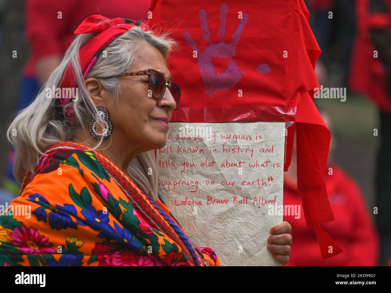 A participant during the annual Red Dress Day march in downtown Edmonton, hosted by Project ...