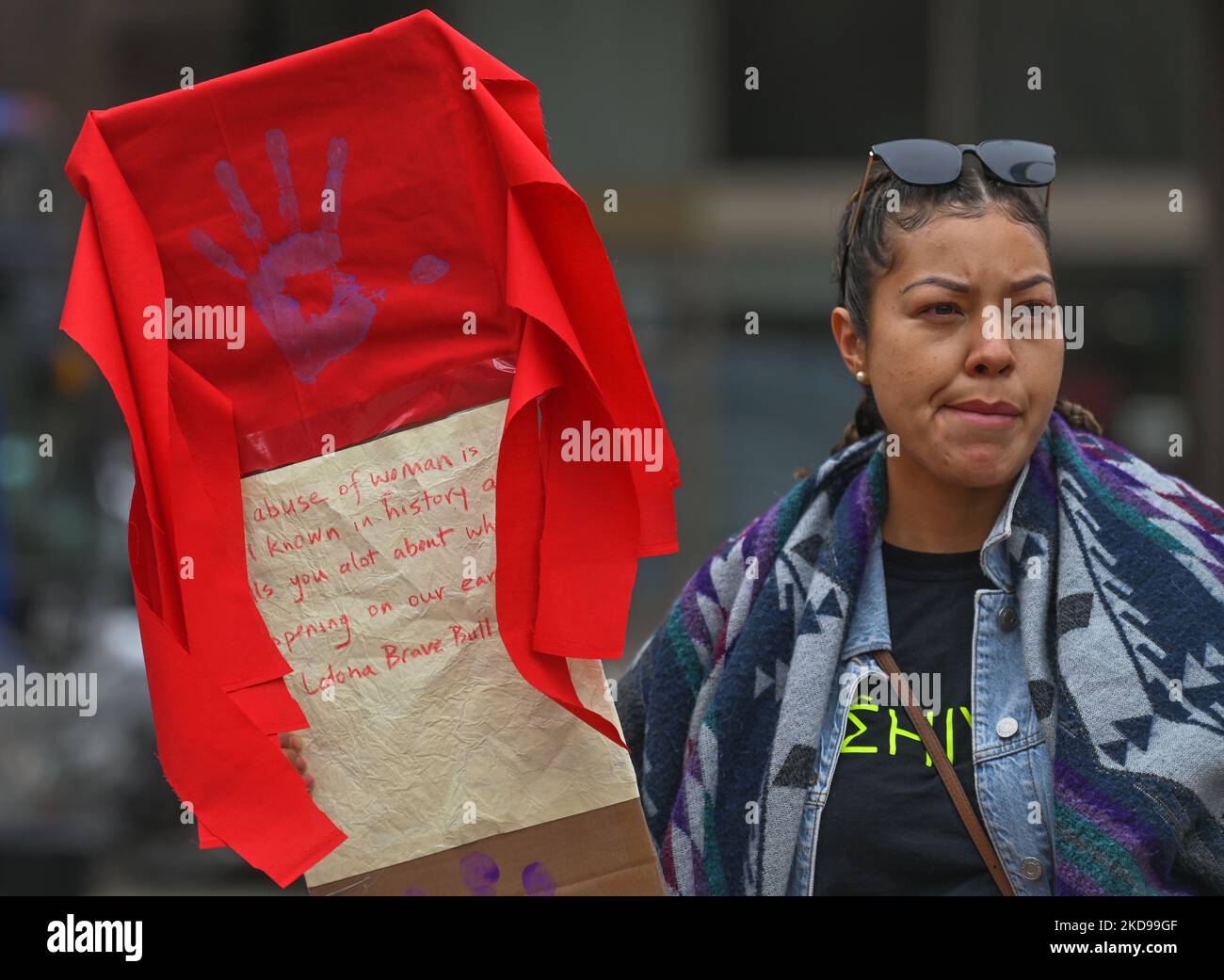 A participant during the annual Red Dress Day march in downtown Edmonton, hosted by Project ...