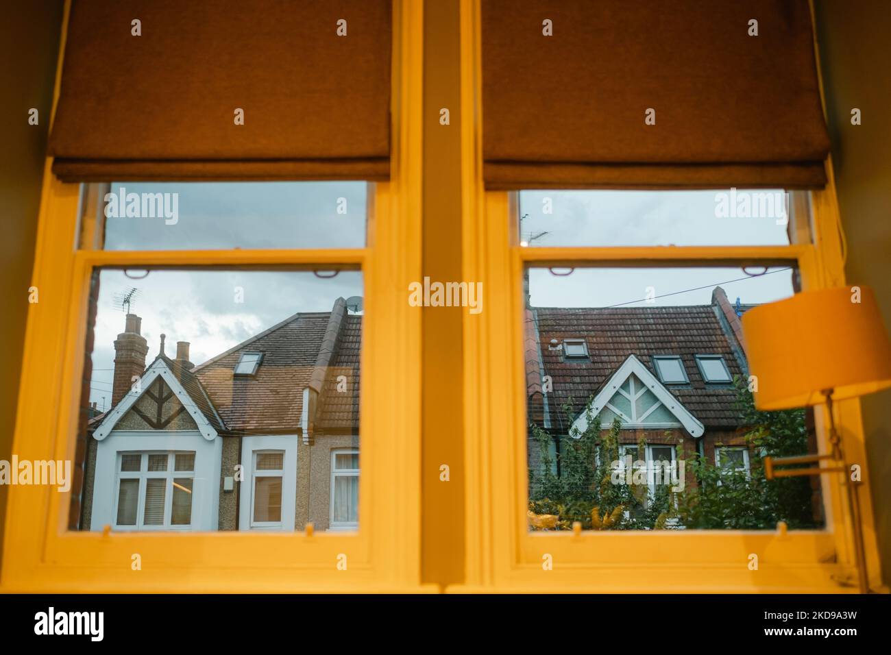 A neighboring house reflecting on the glass windows Stock Photo - Alamy