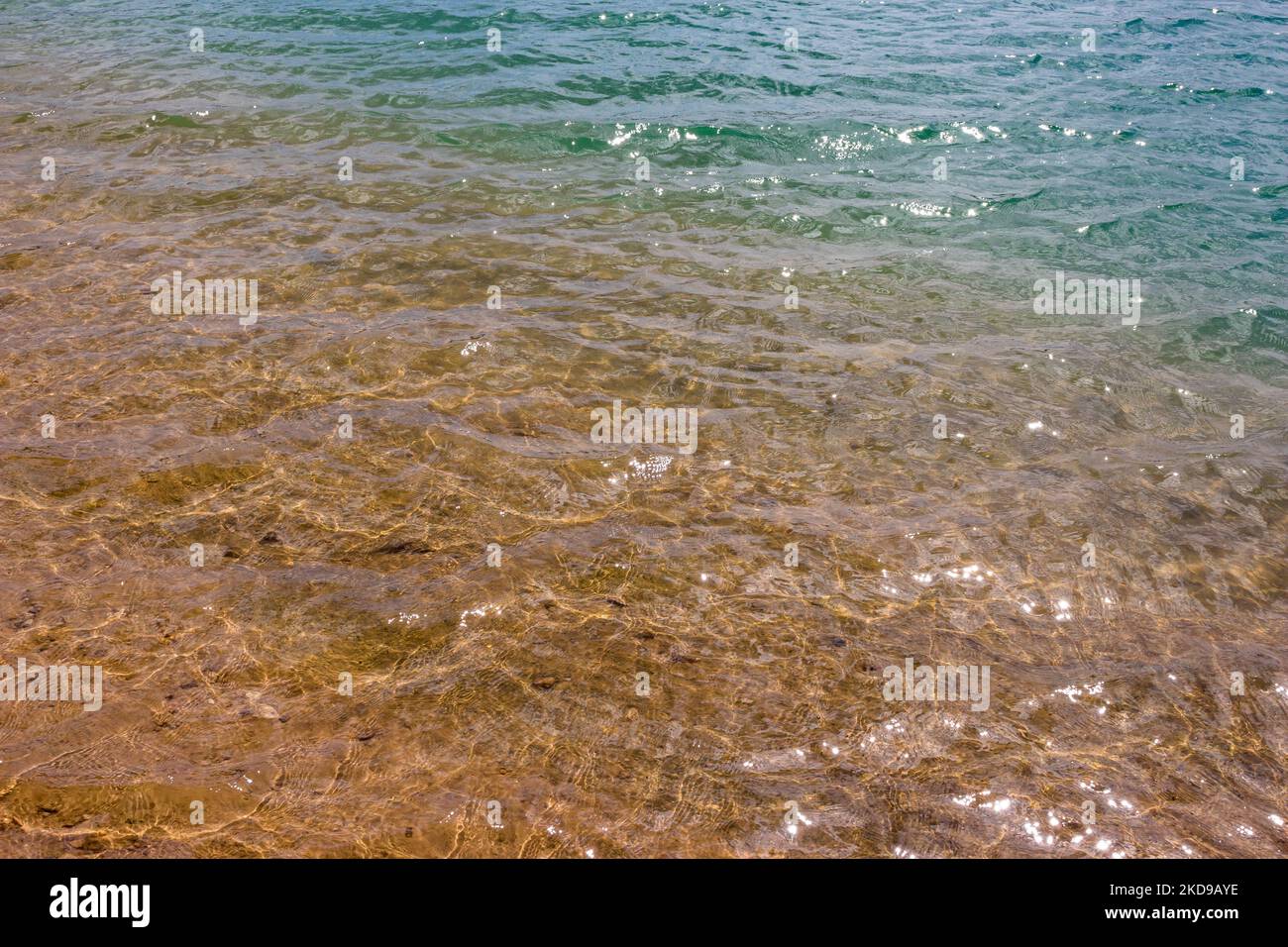 Yellow turquoise color of water on the sandy shore, beautiful ...