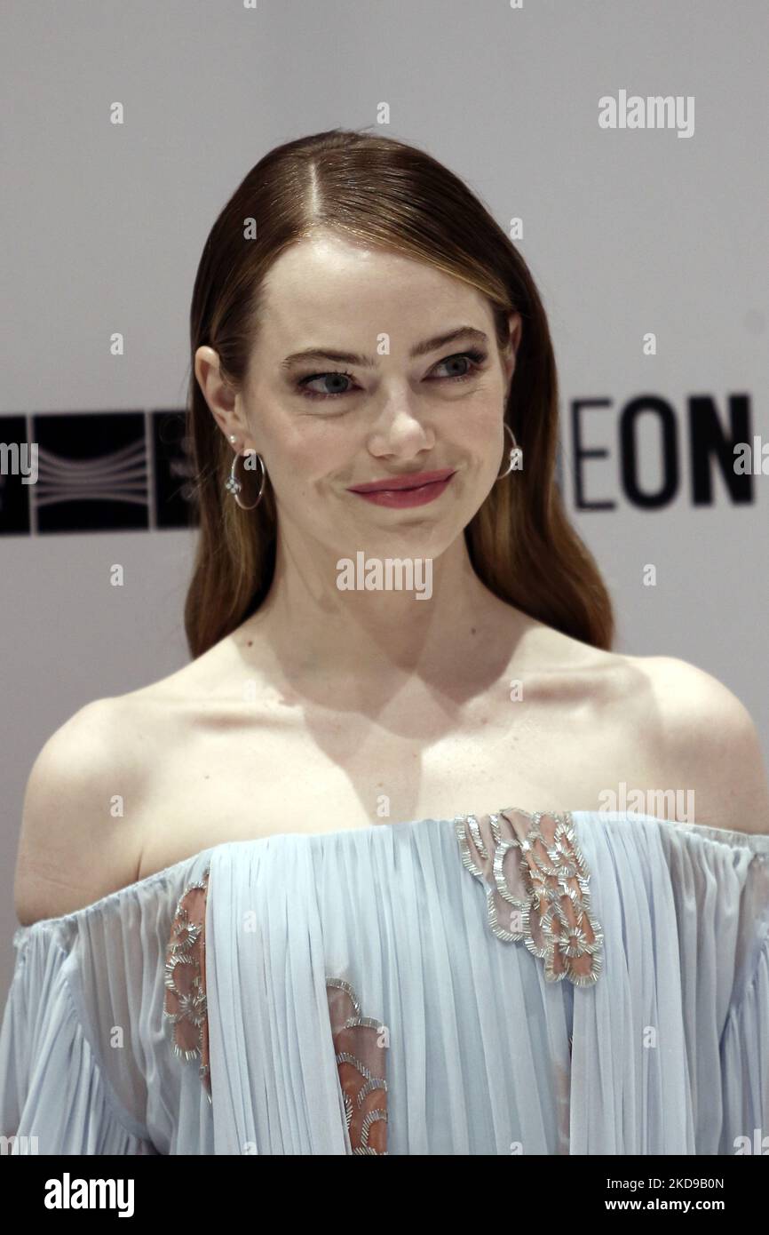Actress Emma Stone and pose for photographers before the premiere of ...
