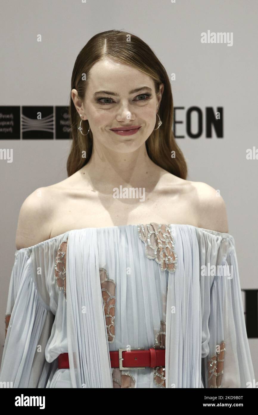 Actress Emma Stone and pose for photographers before the premiere of ...