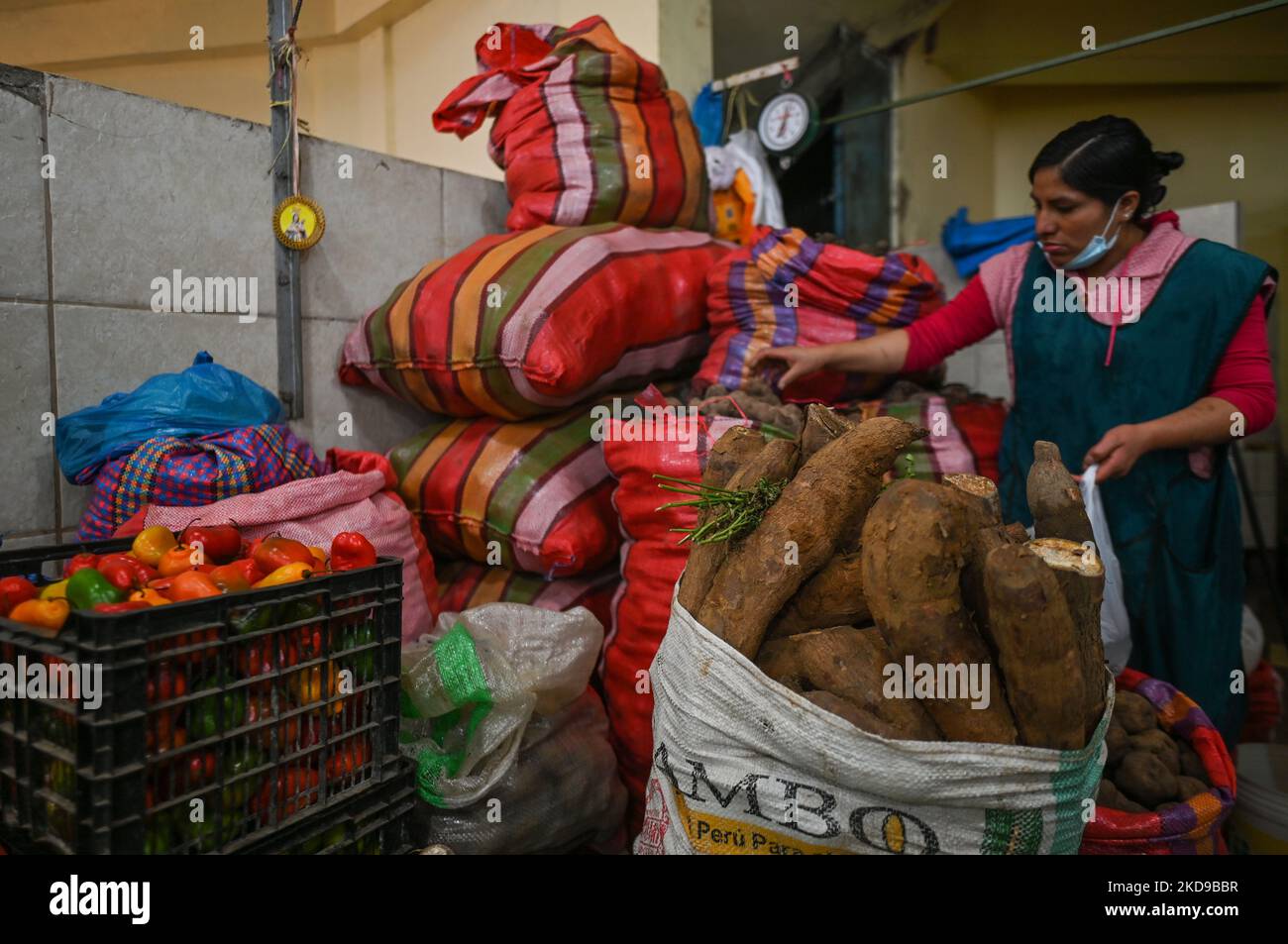 Vegetable vendor at the local market in Aguas Calientes. On Wednesday ...