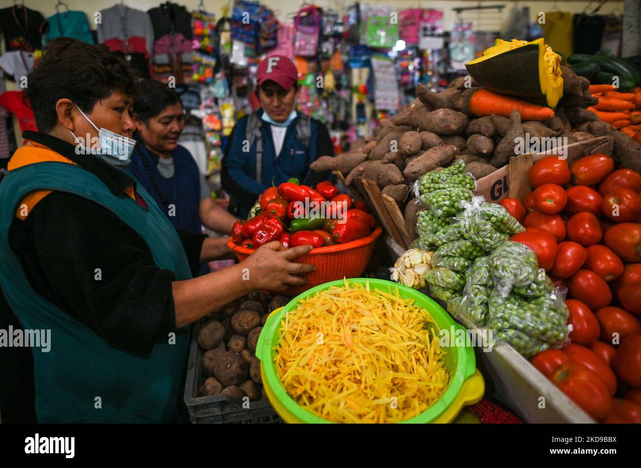 Vegetable vendor at the local market in Aguas Calientes. On Wednesday ...