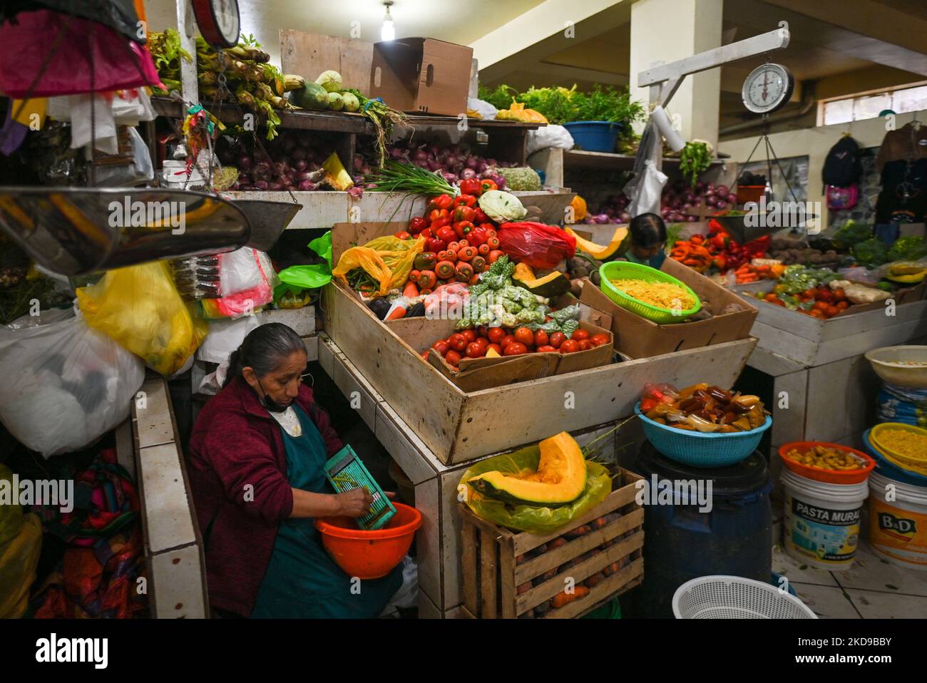 Vegetable vendor at the local market in Aguas Calientes. On Wednesday ...