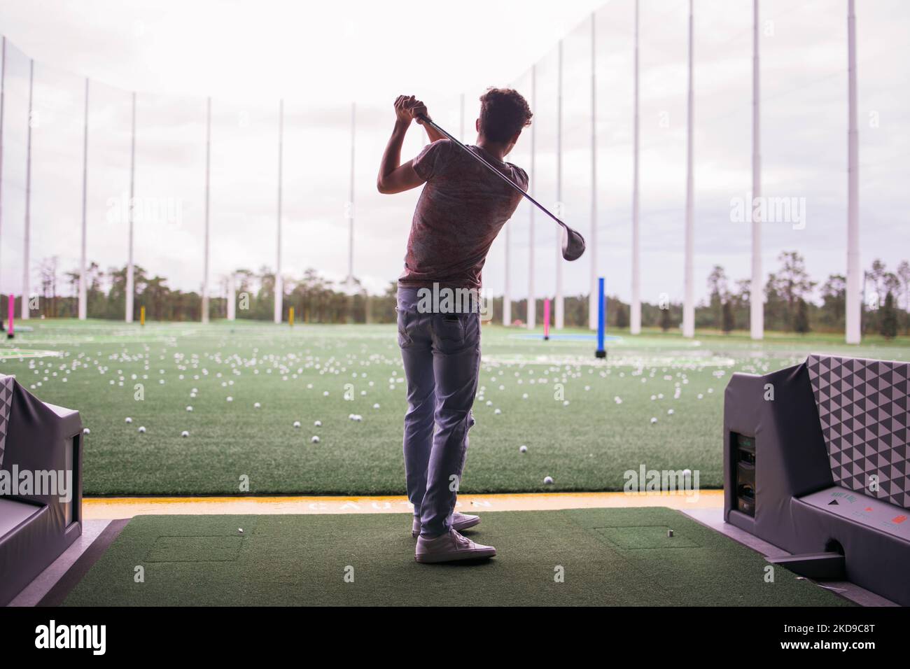 A male playing gold in the green sports field Stock Photo - Alamy