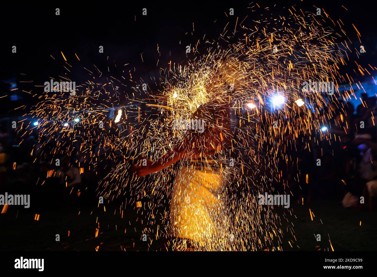 A Balinese man is hit with burning dried coconut leaves during a fire ...
